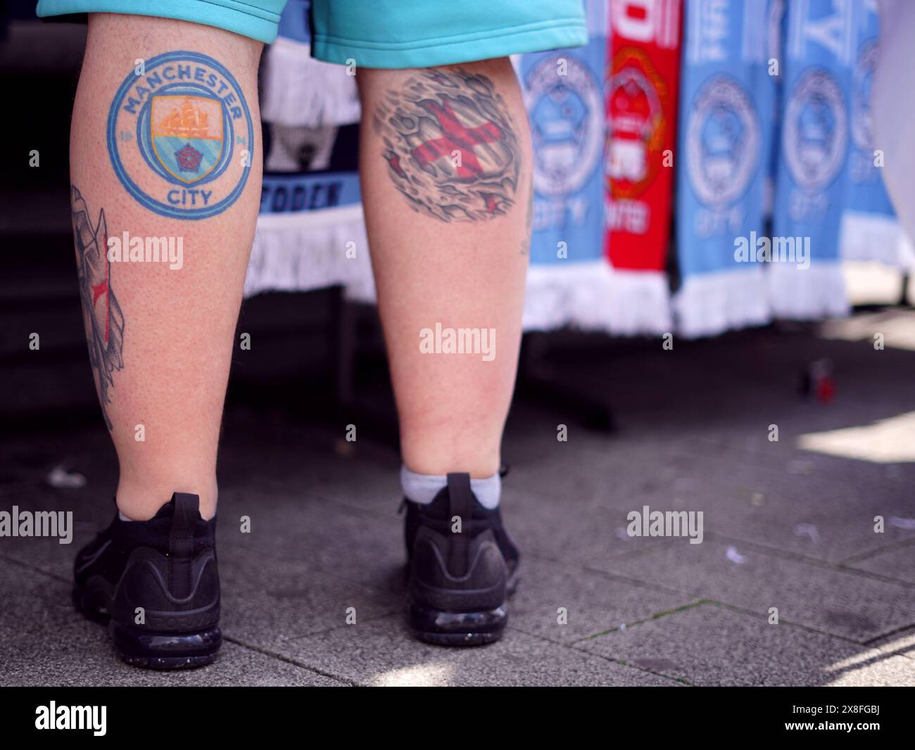 A Manchester City fan with a club tattoo on their leg ahead of the ...