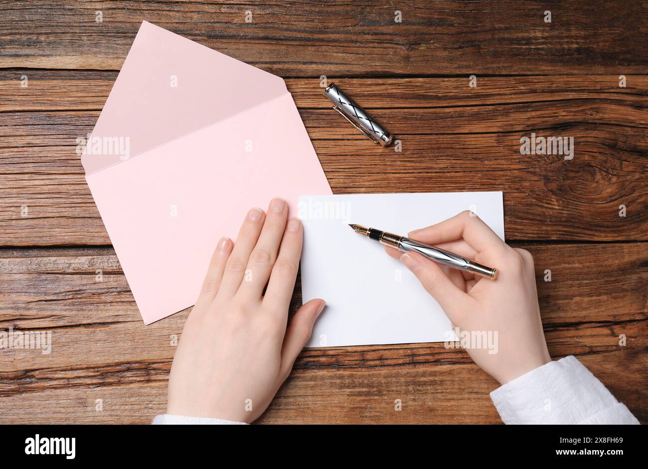 Woman writing letter with envelope hi-res stock photography and images ...