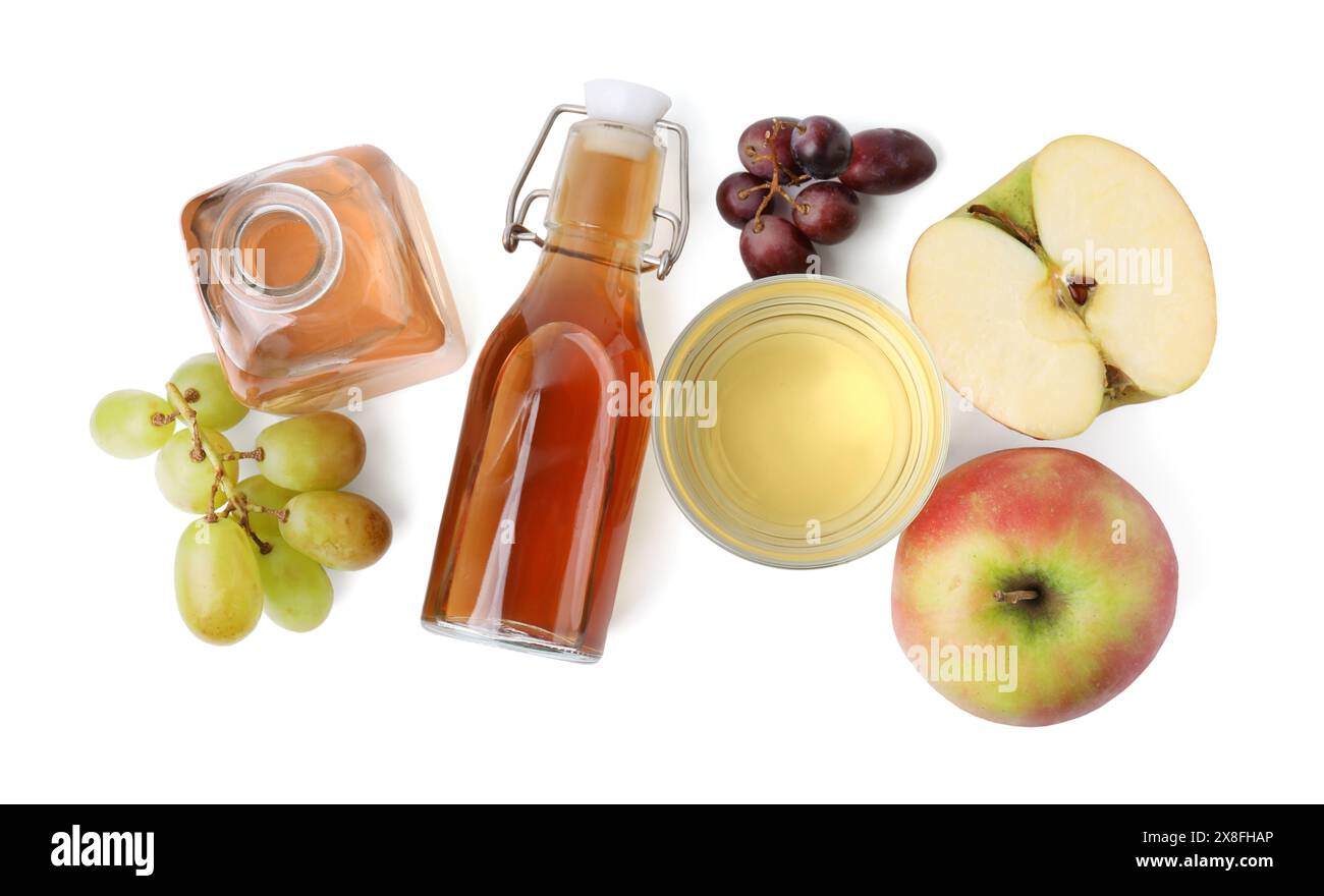 Different types of vinegar and ingredients isolated on white, top view ...