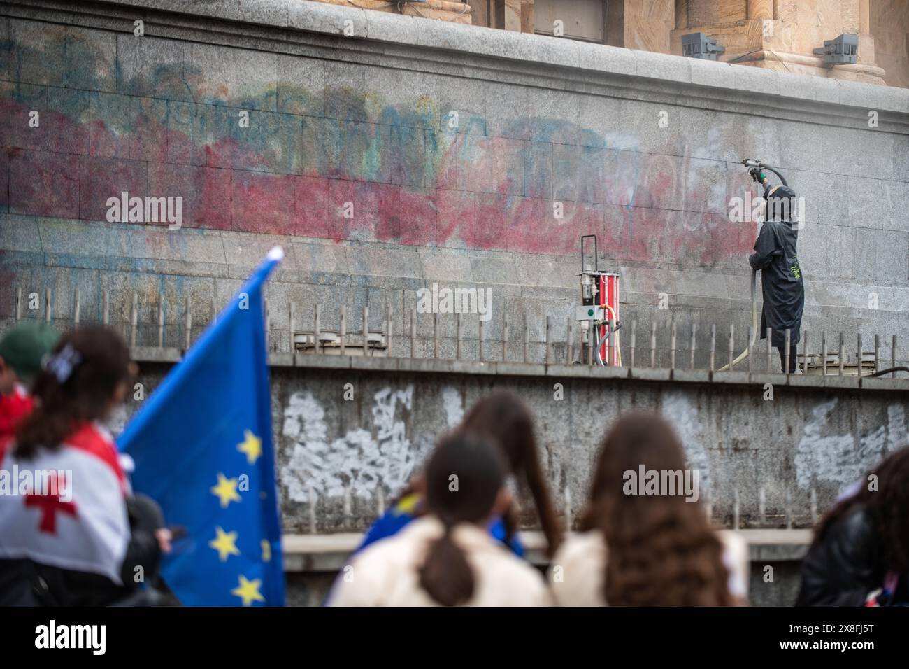 May 24th 2024, Tbilisi, Georgia. Protesters watch as graffiti is ...