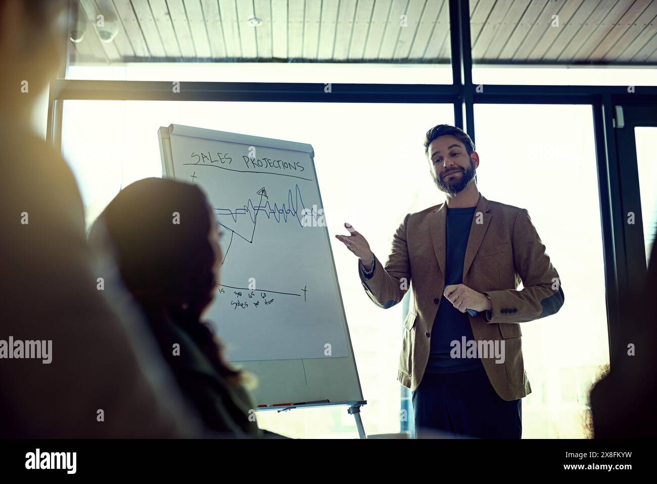 Business man, sales presentation and training with meeting chart ...