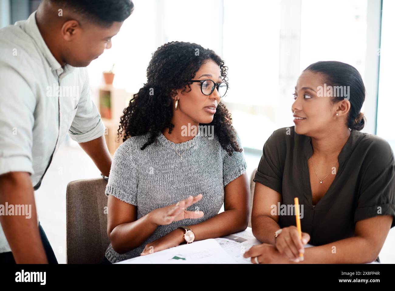 Business meeting, people and architecture with blueprints for building ...