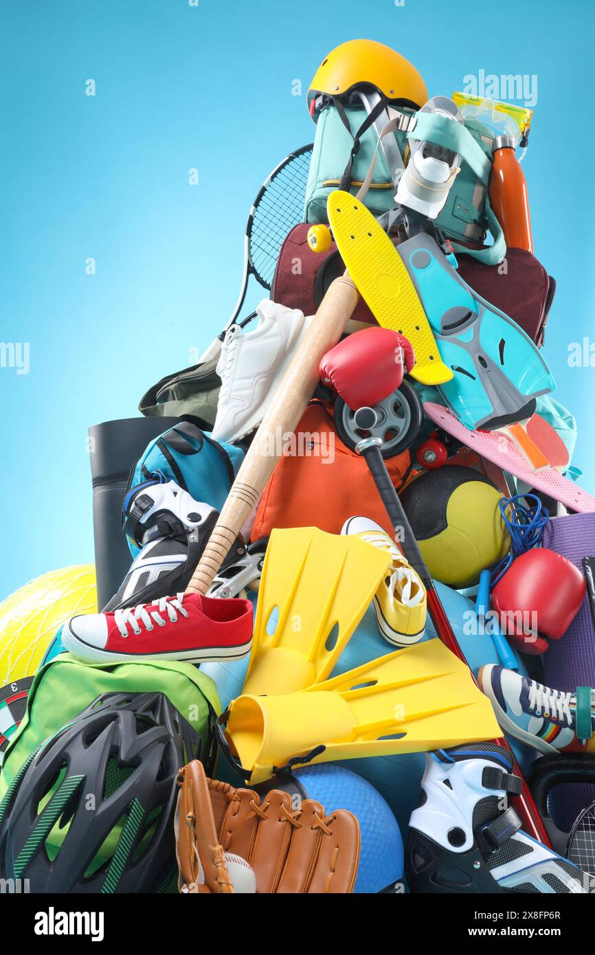 Many different sports equipment on light blue background Stock Photo ...