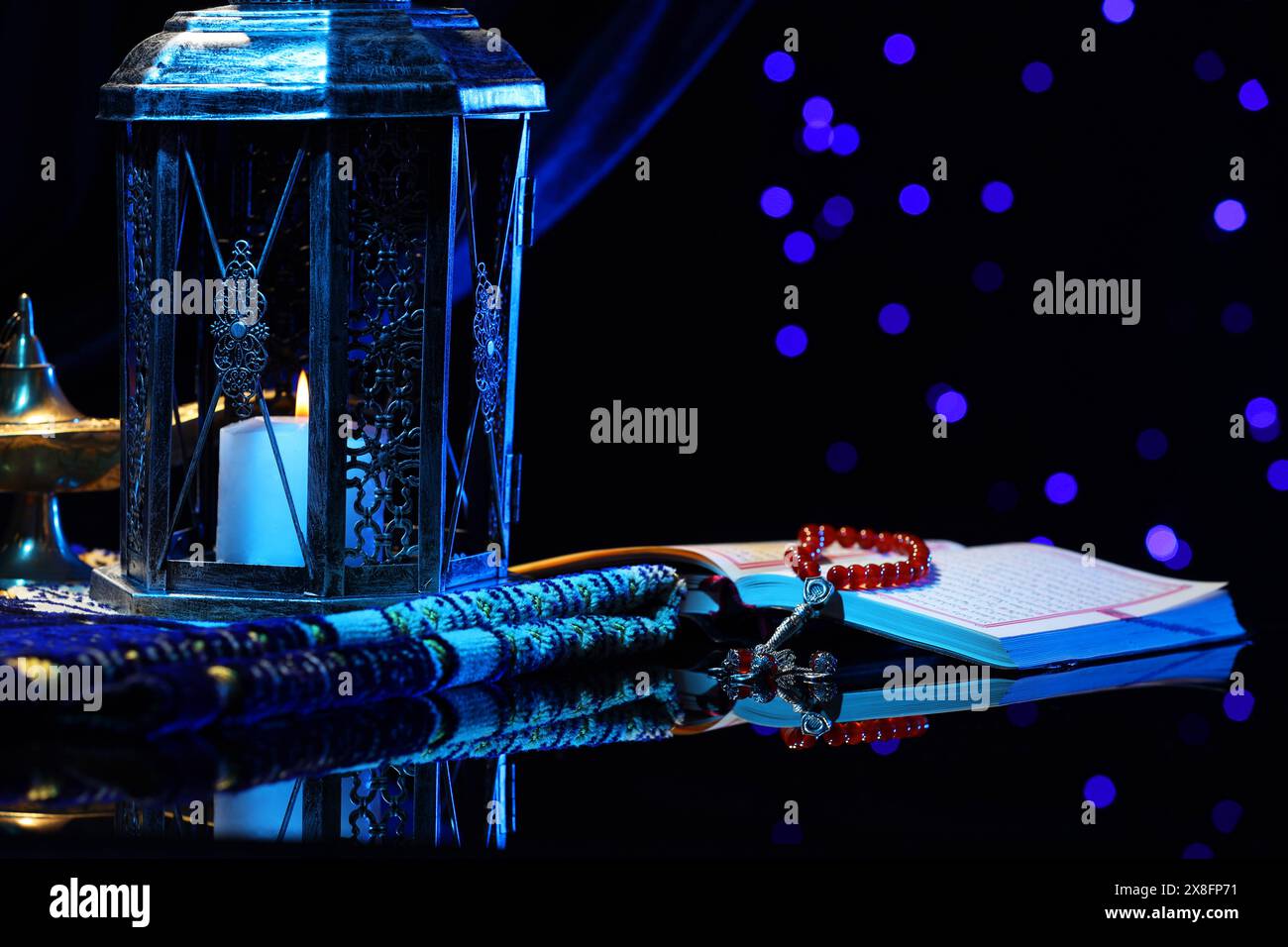 Arabic lantern, Quran, misbaha, Aladdin magic lamp and folded prayer ...