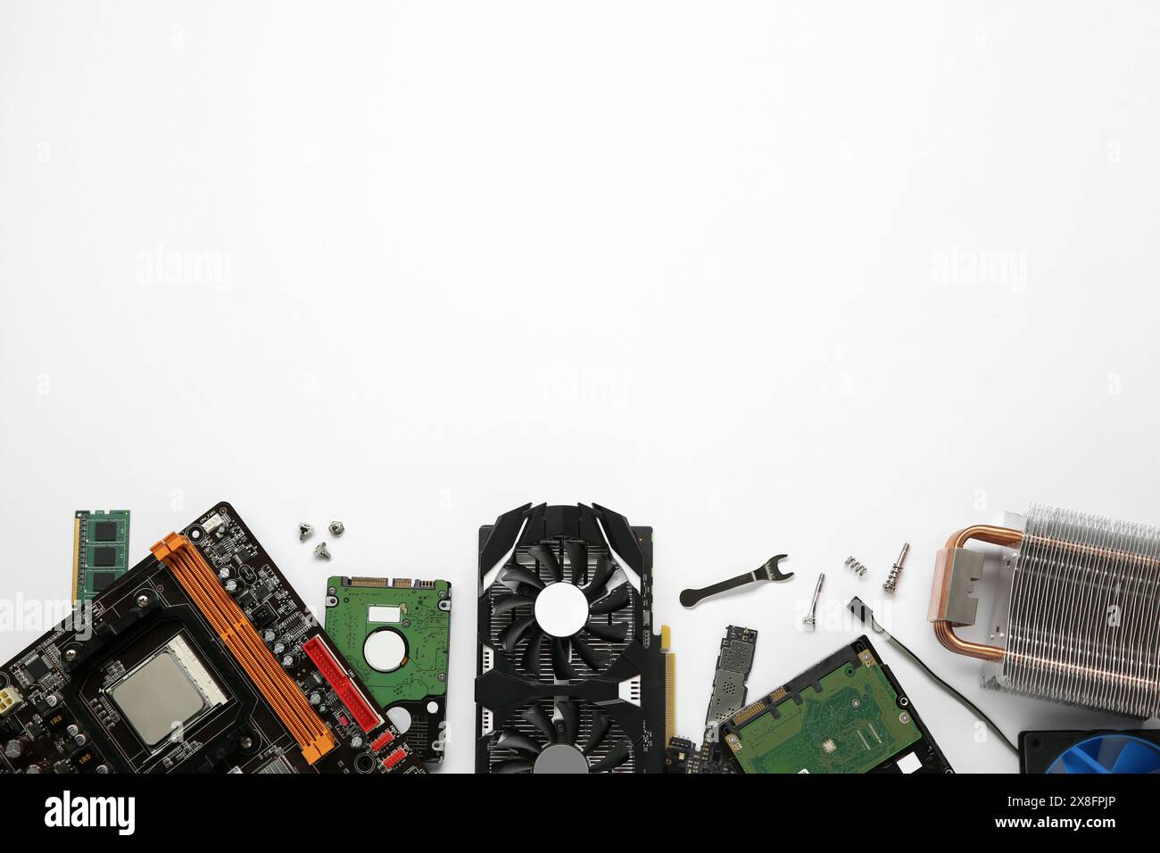 Graphics card and other computer hardware on white background, flat lay ...