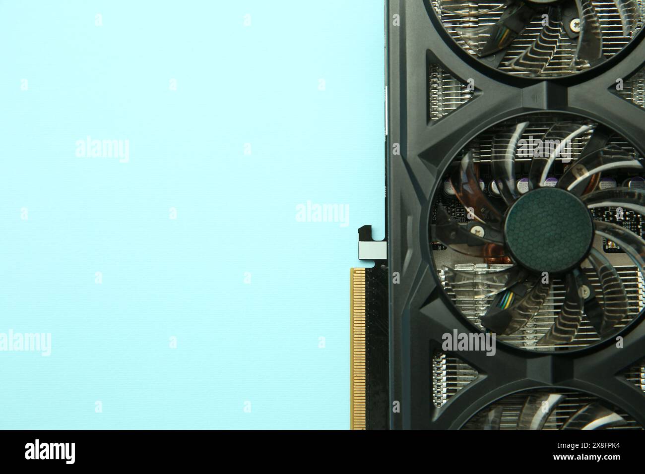 One graphics card on light blue background, top view. Space for text ...