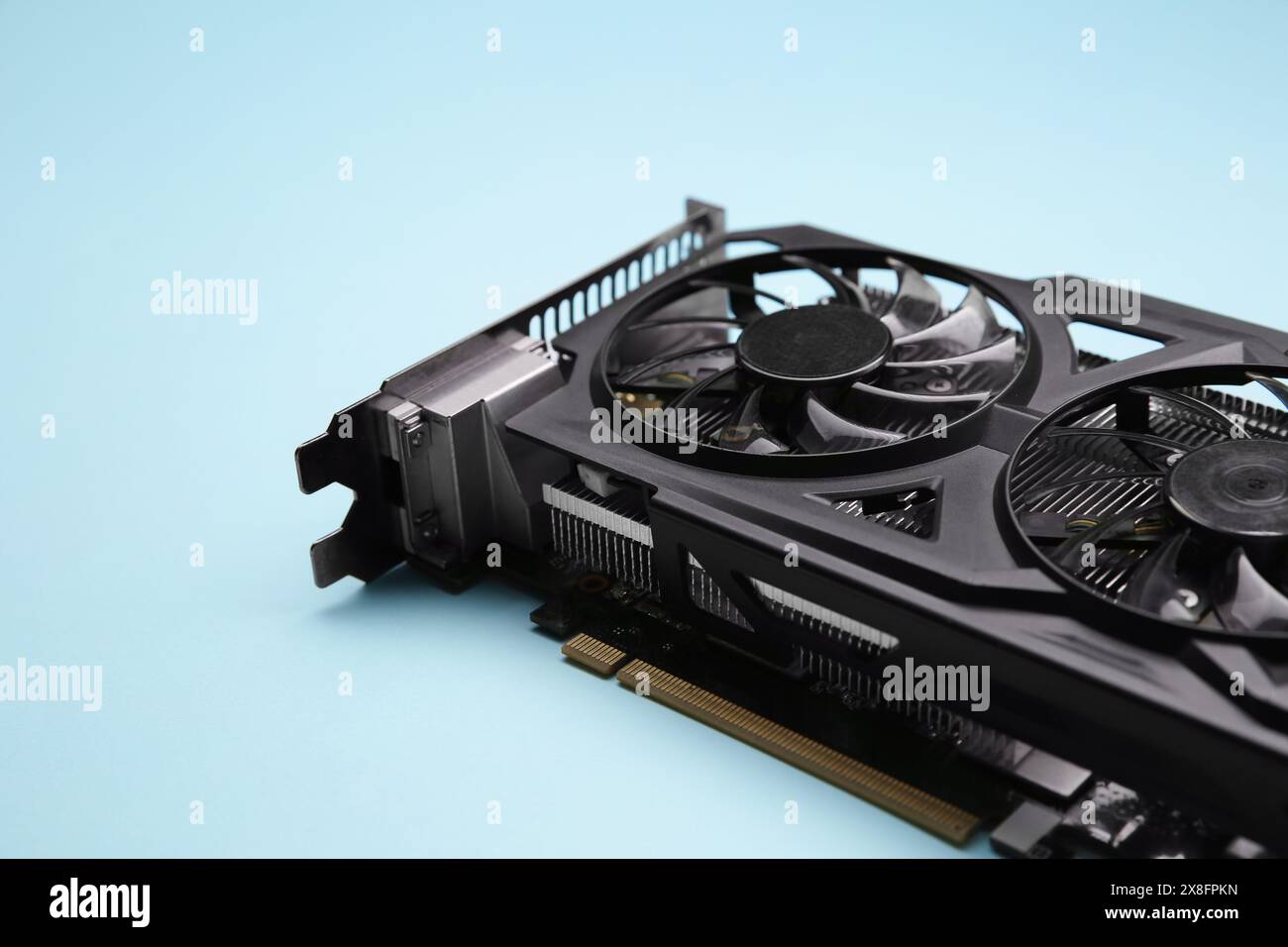 One graphics card on light blue background, closeup Stock Photo - Alamy