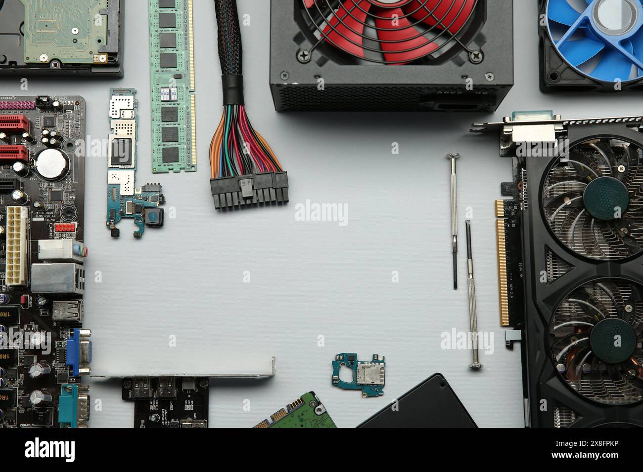 Frame of graphics card and other computer hardware on light background ...