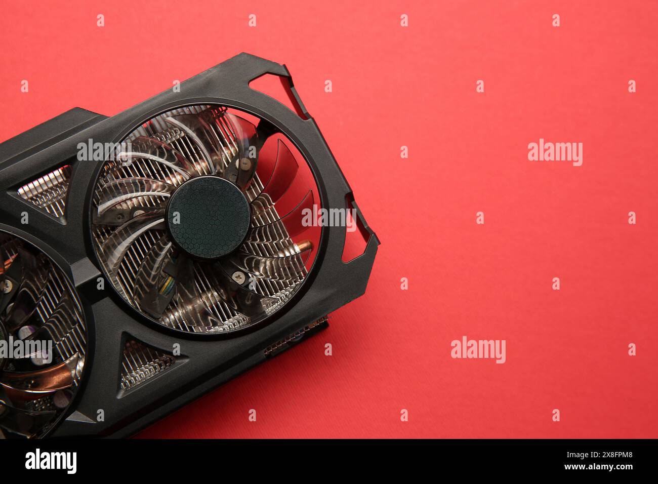 One graphics card on red background, top view. Space for text Stock ...