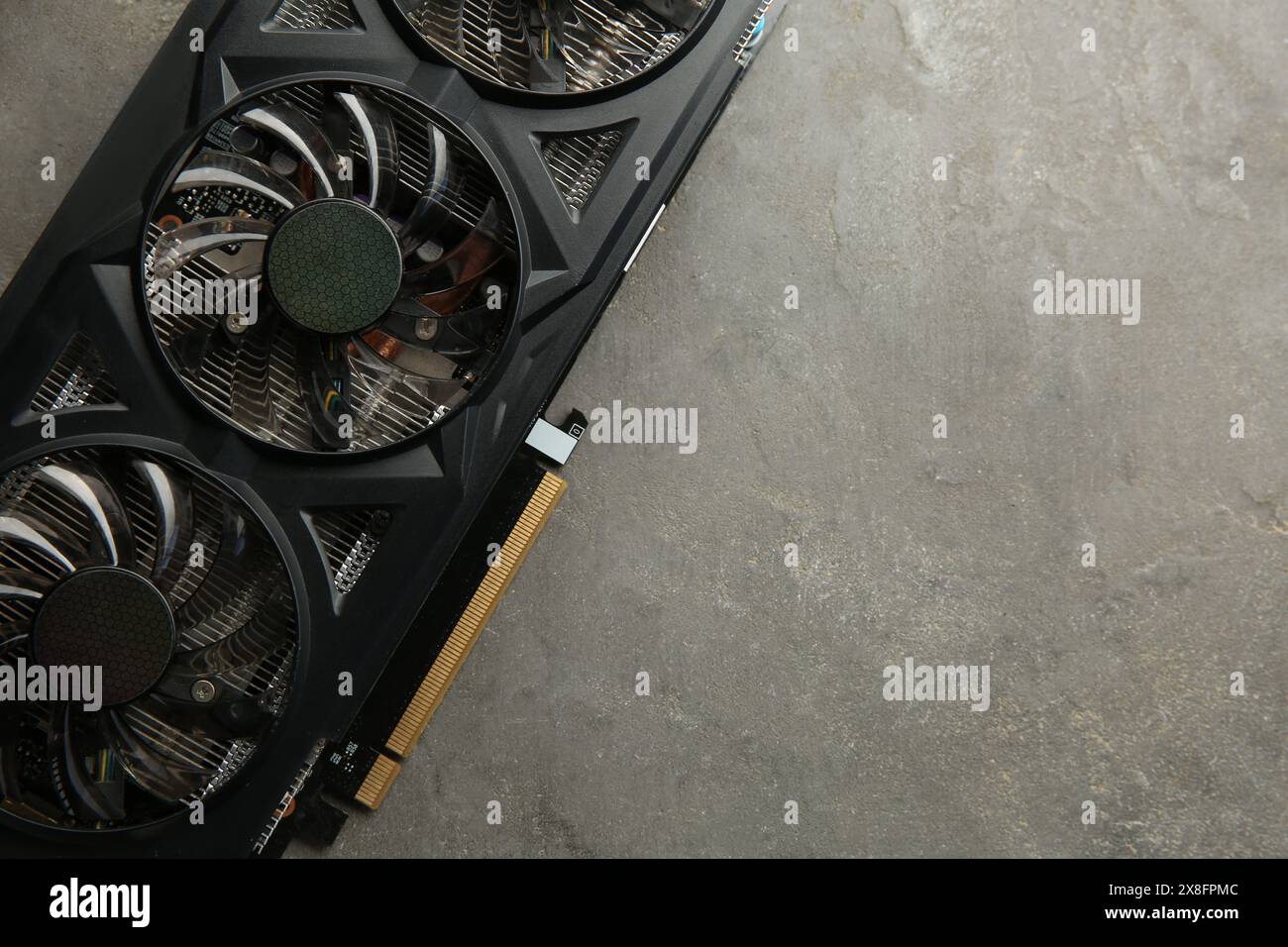One graphics card on grey table, top view. Space for text Stock Photo ...