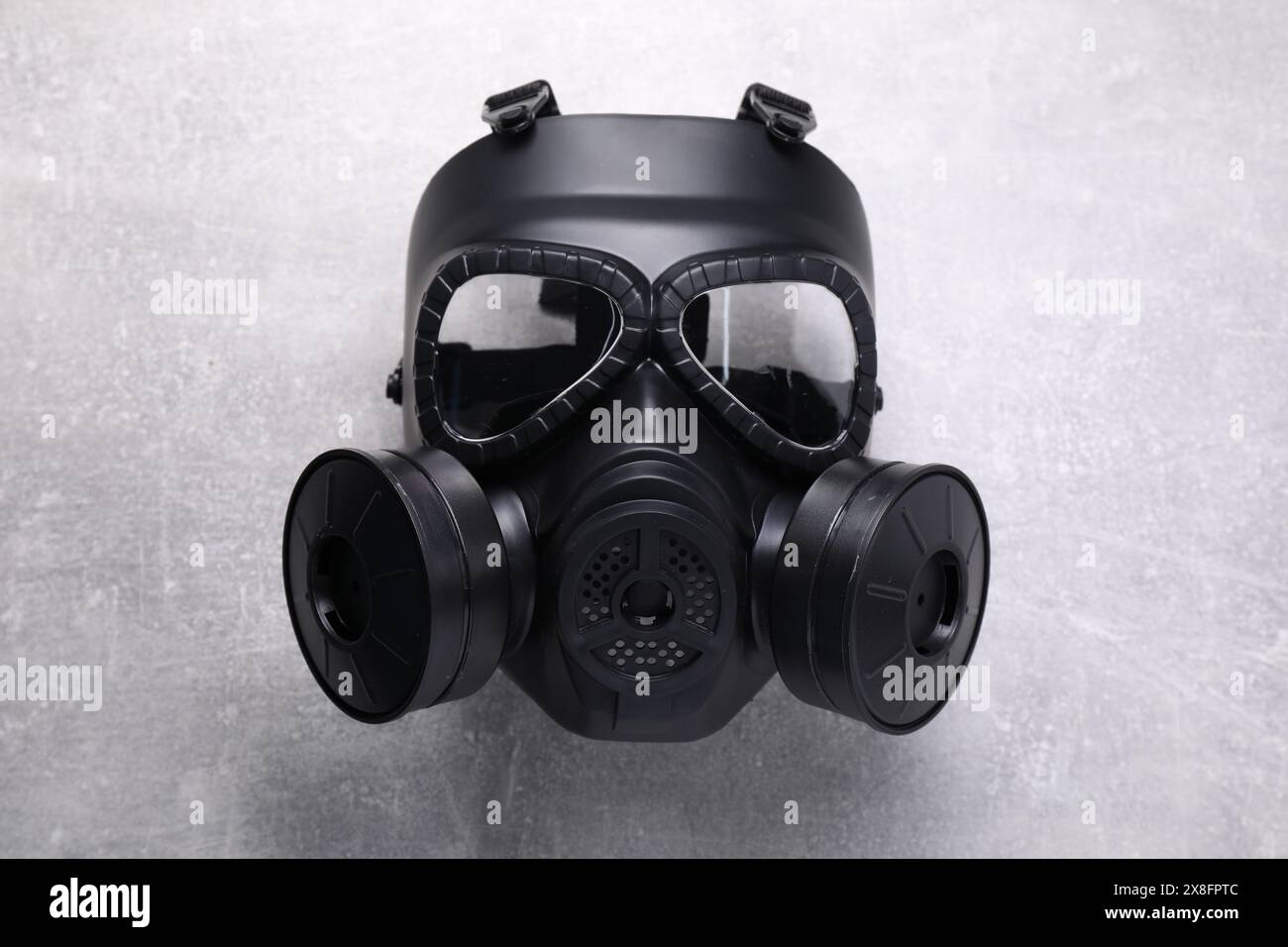 One gas mask on grey textured background, top view Stock Photo - Alamy