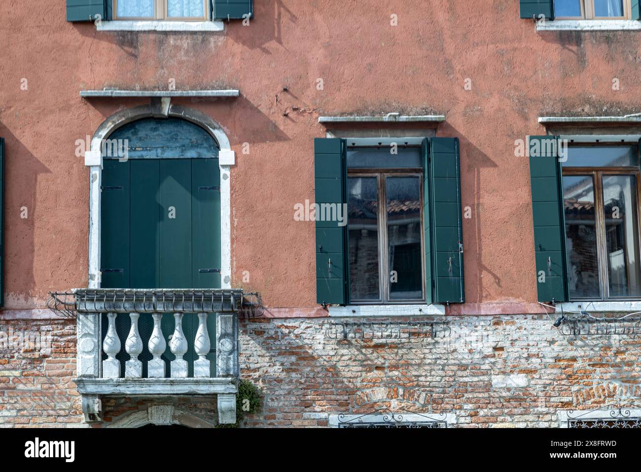 Doors and windows of ancient Venetian houses Stock Photo - Alamy