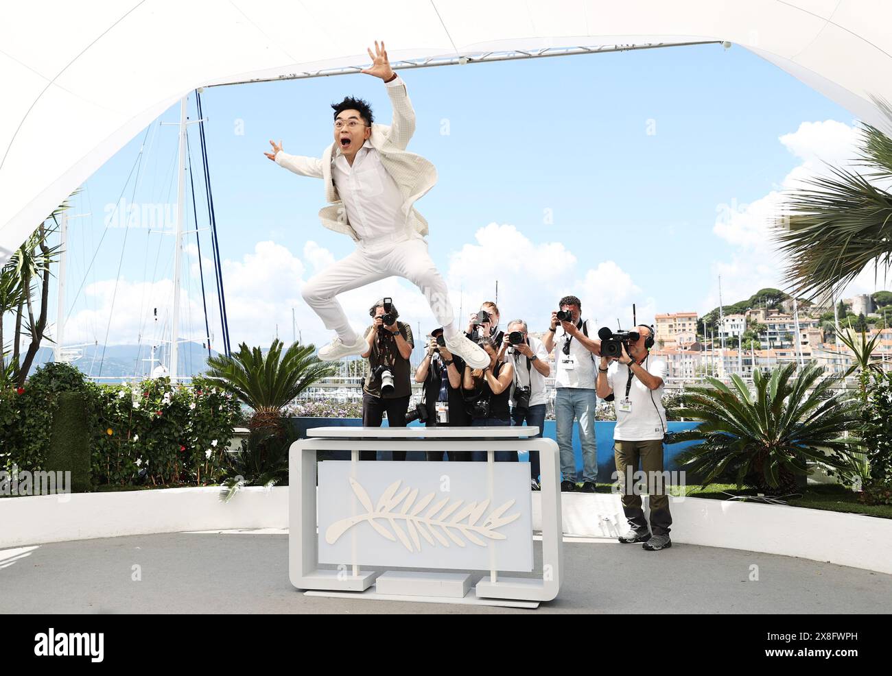 Cannes, France. 25th May, 2024. Actor Da Peng poses during a photocall ...