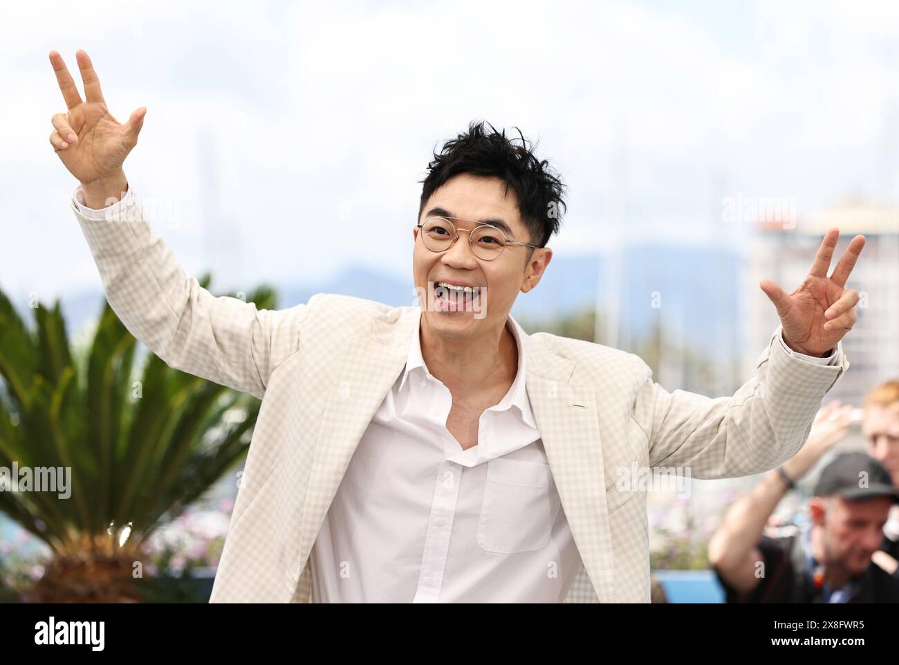 Cannes, France. 25th May, 2024. Actor Da Peng poses during a photocall ...