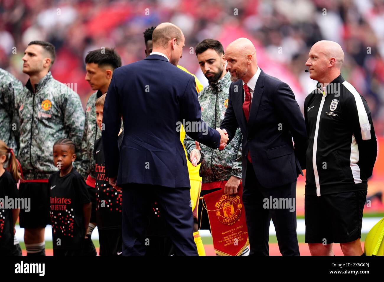 The Prince of Wales shakes hands with Manchester United manager Erik ...