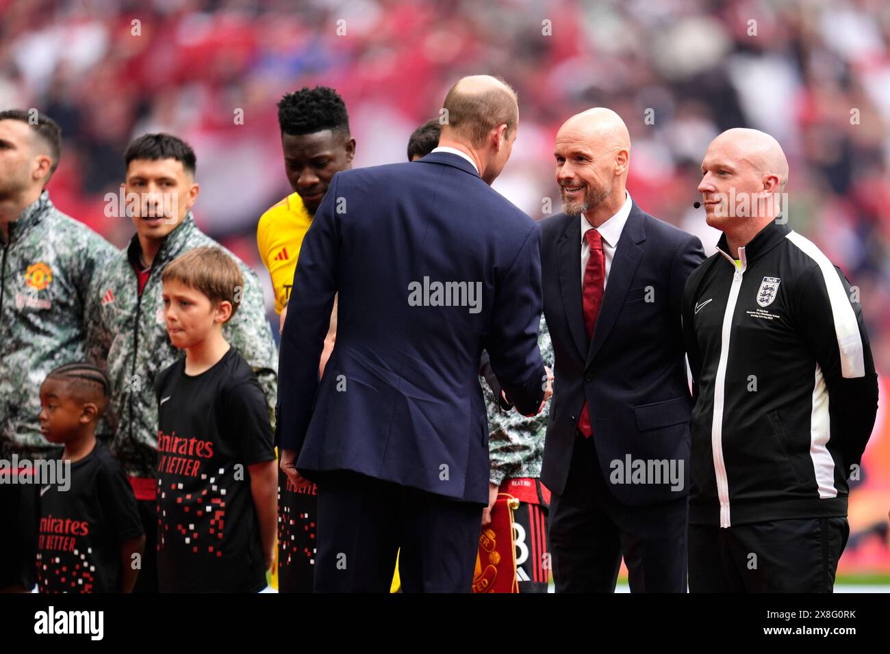 The Prince of Wales shakes hands with Manchester United manager Erik ...
