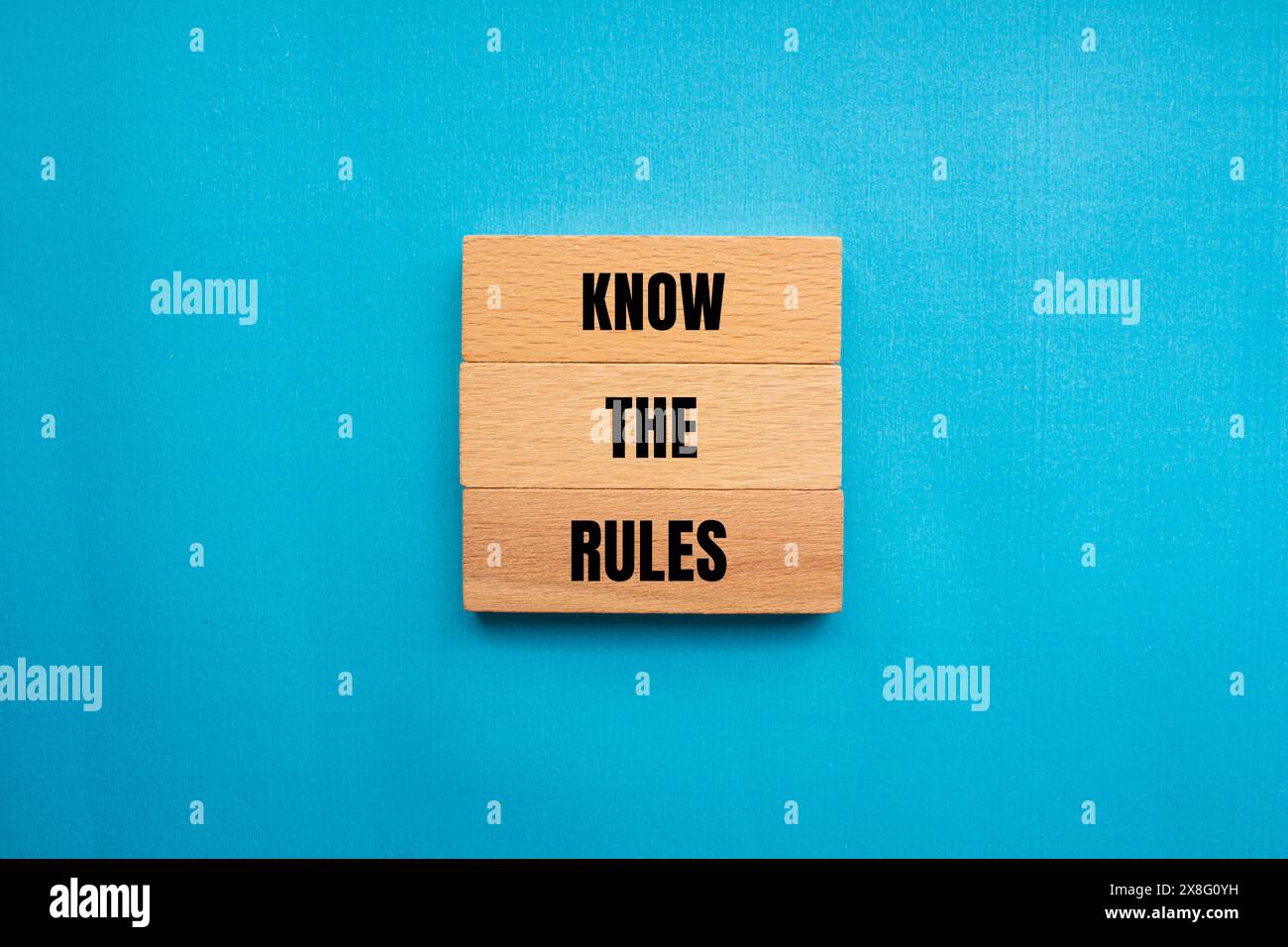 Know the rules words written on wooden blocks with blue background ...