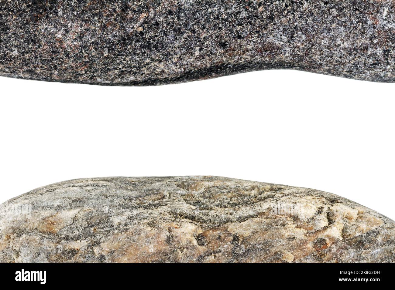 Edges of two pebbles isolated on white background with a space for text ...