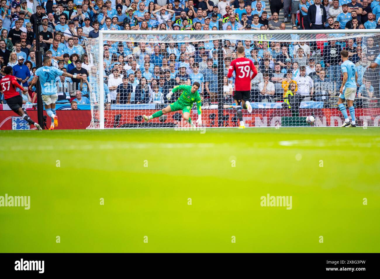 Kobbie Mainoo #37 of Manchester United makes it 0-2 during the FA Cup ...