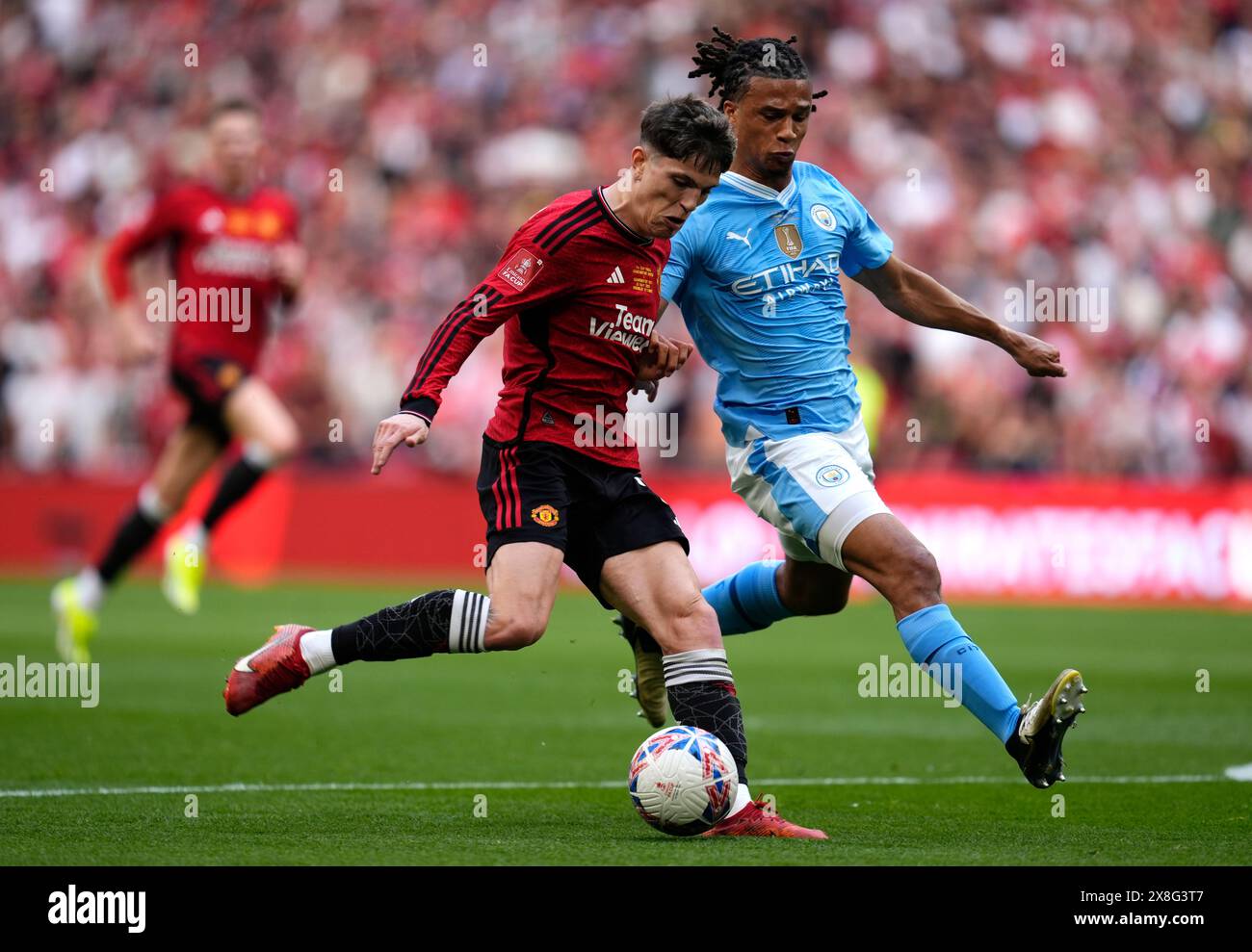 Manchester United's Alejandro Garnacho (left) and Manchester City's ...