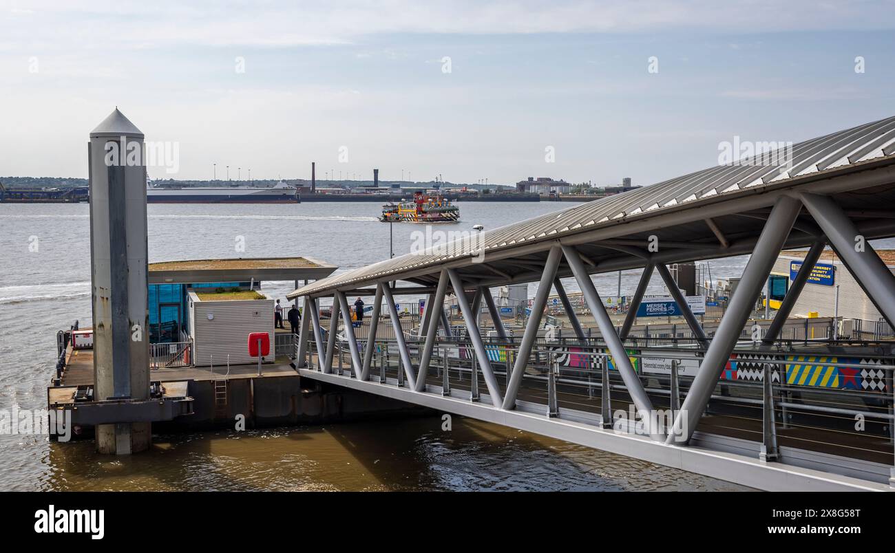 Mersey Ferry dock ramp with the Dazzle Ferry coming in to moor at ...