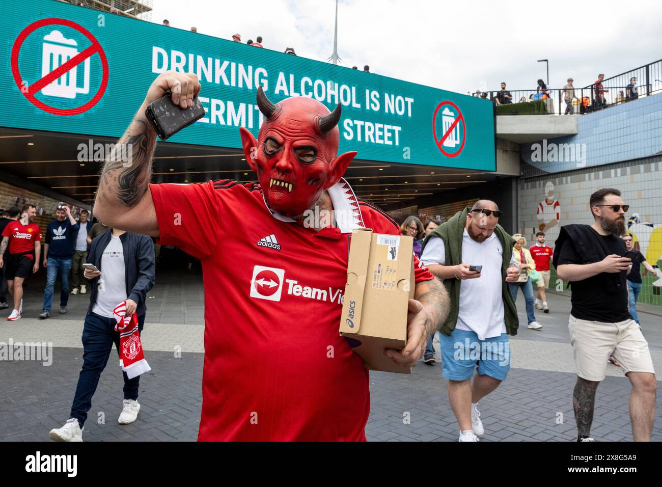 London, UK. 25 May 2024. A Manchester United fan, dressed as a Red ...