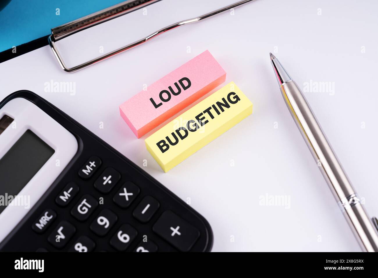 Loud budgeting text on clipboard business and financial concept Stock ...