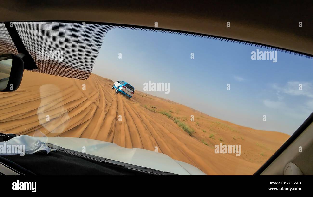 Photography of driving through desert photographed from car front seat ...