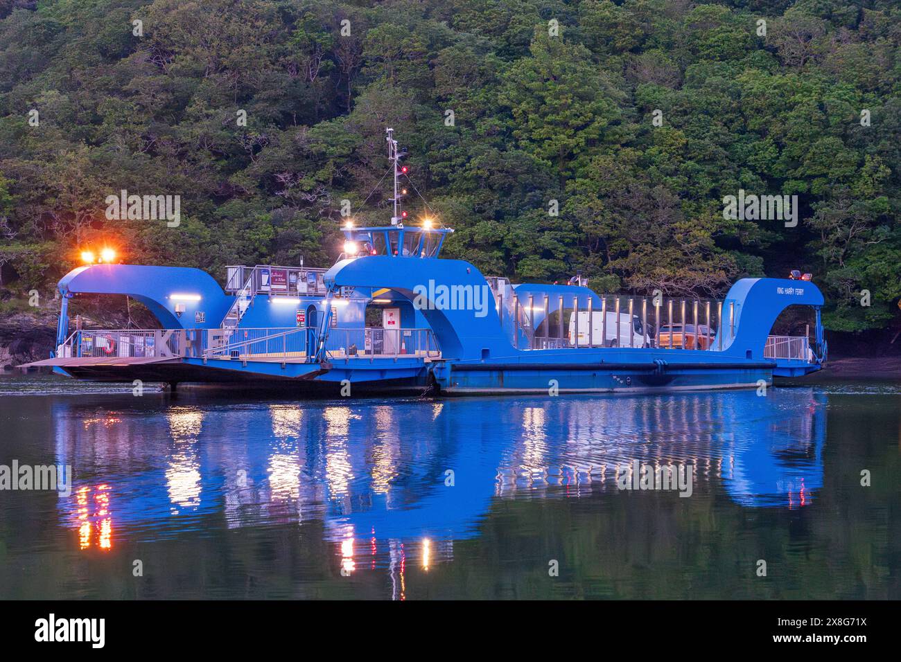 The King Harry chain ferry on a dusk crossing of the River Fal at the ...