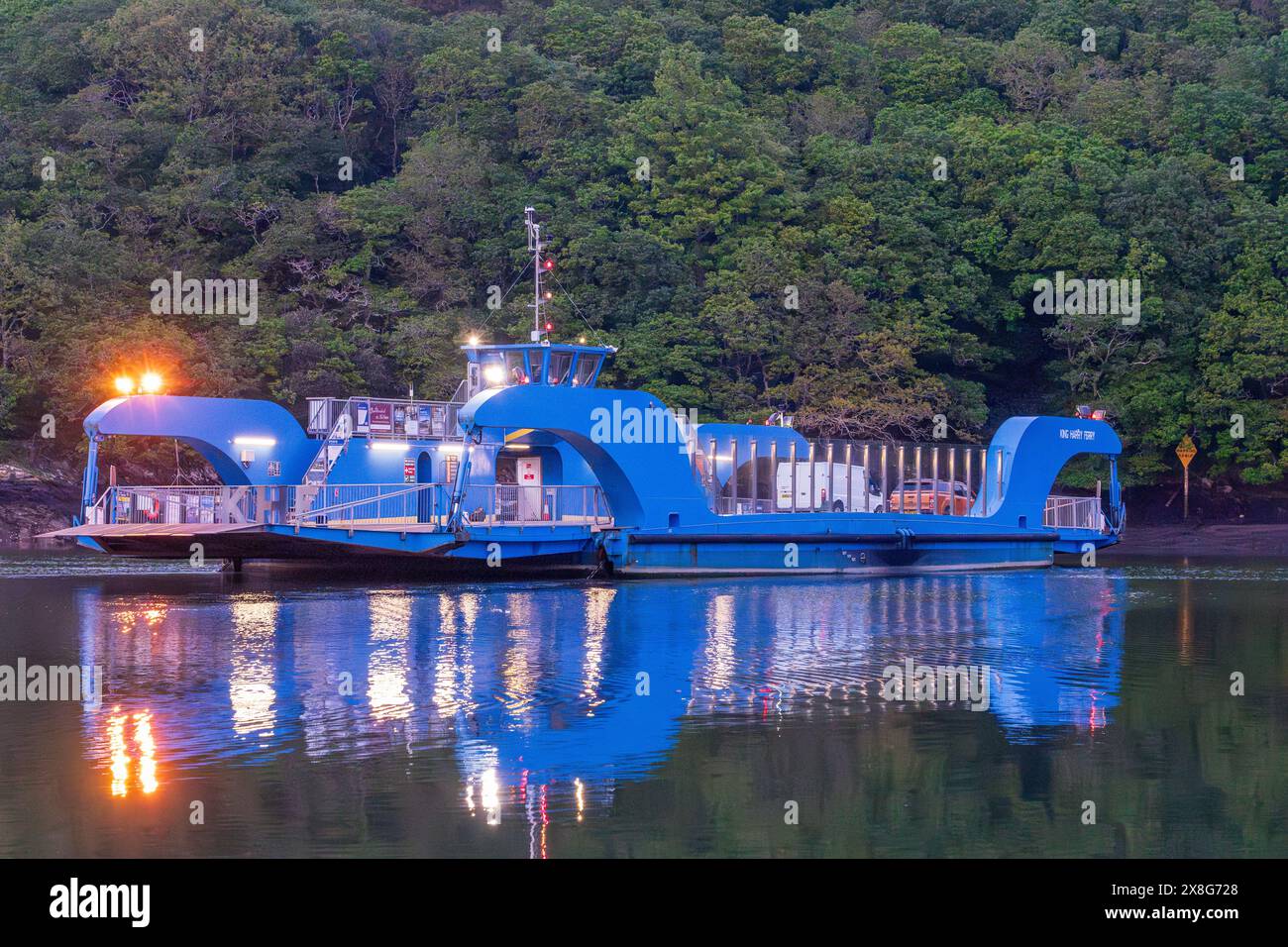 The King Harry chain ferry on a dusk crossing of the River Fal at the ...