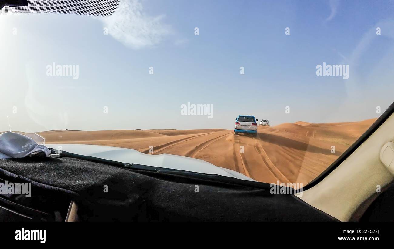 Photography of driving through desert photographed from car front seat ...