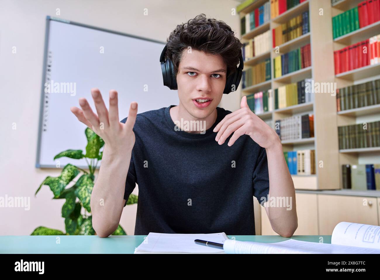 Web cam portrait of college student guy in headphones looking talking ...