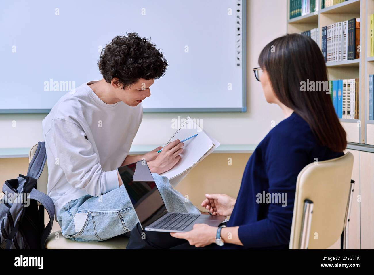 Guy college student talking studying with female teacher Stock Photo ...