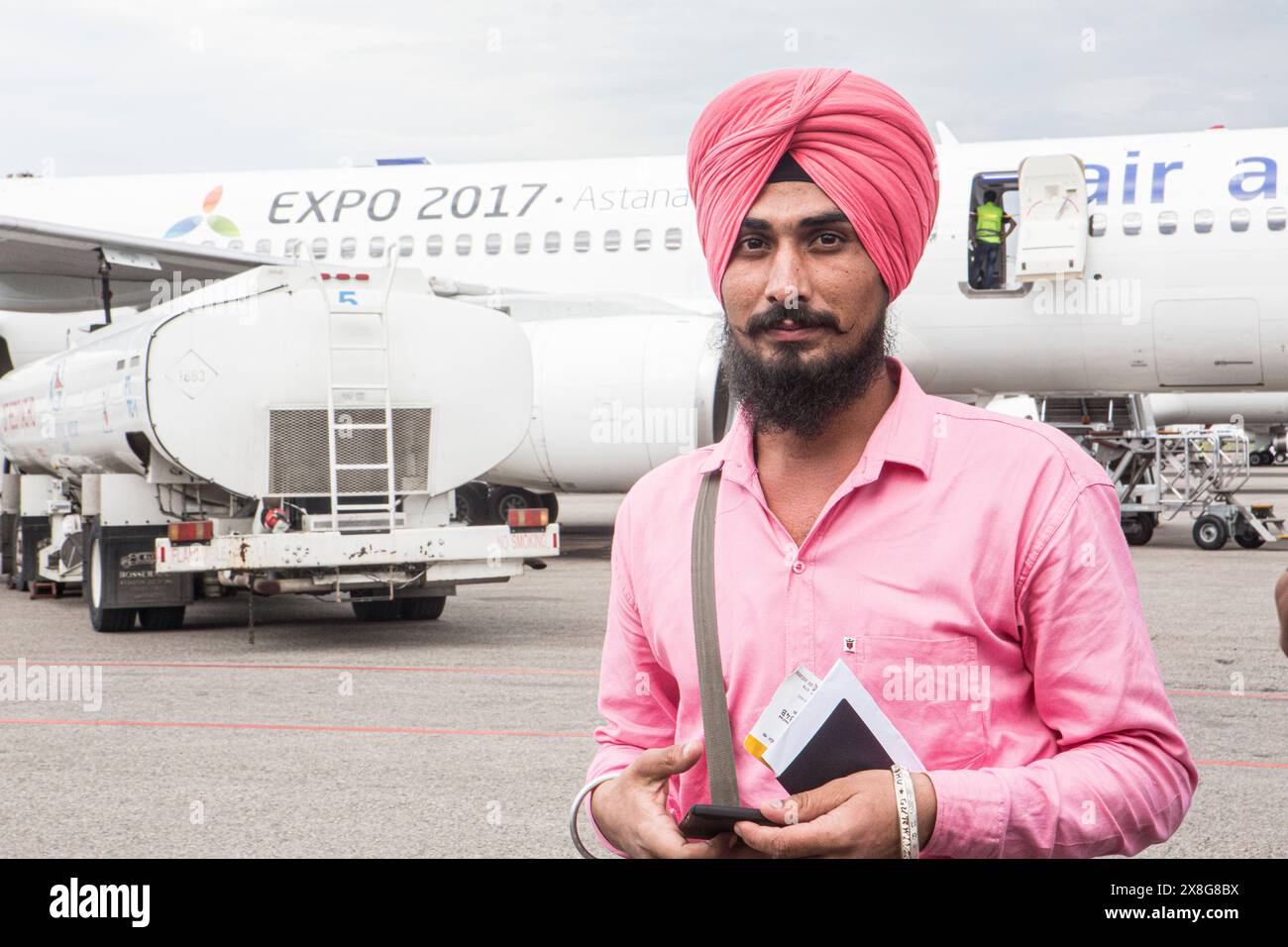 Indian man goes boarding plane hi-res stock photography and images - Alamy