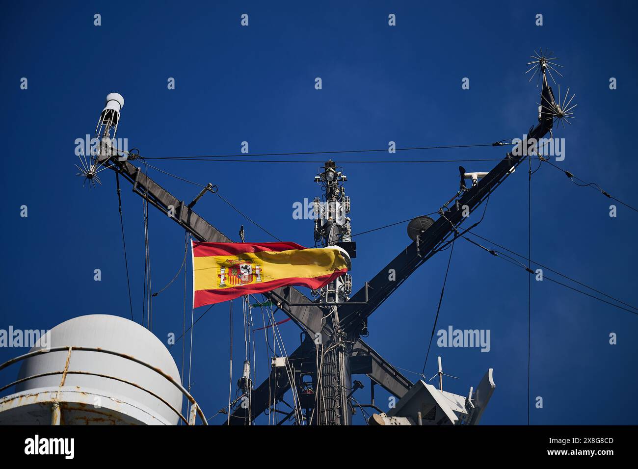 Flag of Spain flying on the communications tower of a navy ship Stock ...