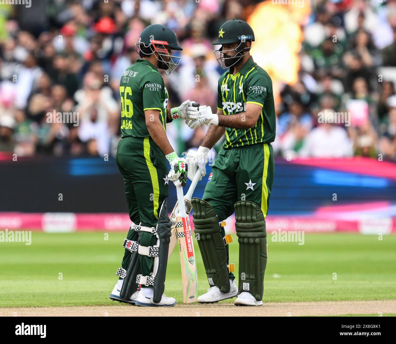 Babar Azam of Pakistan talks with Saim Ayub of Pakistan during the ...