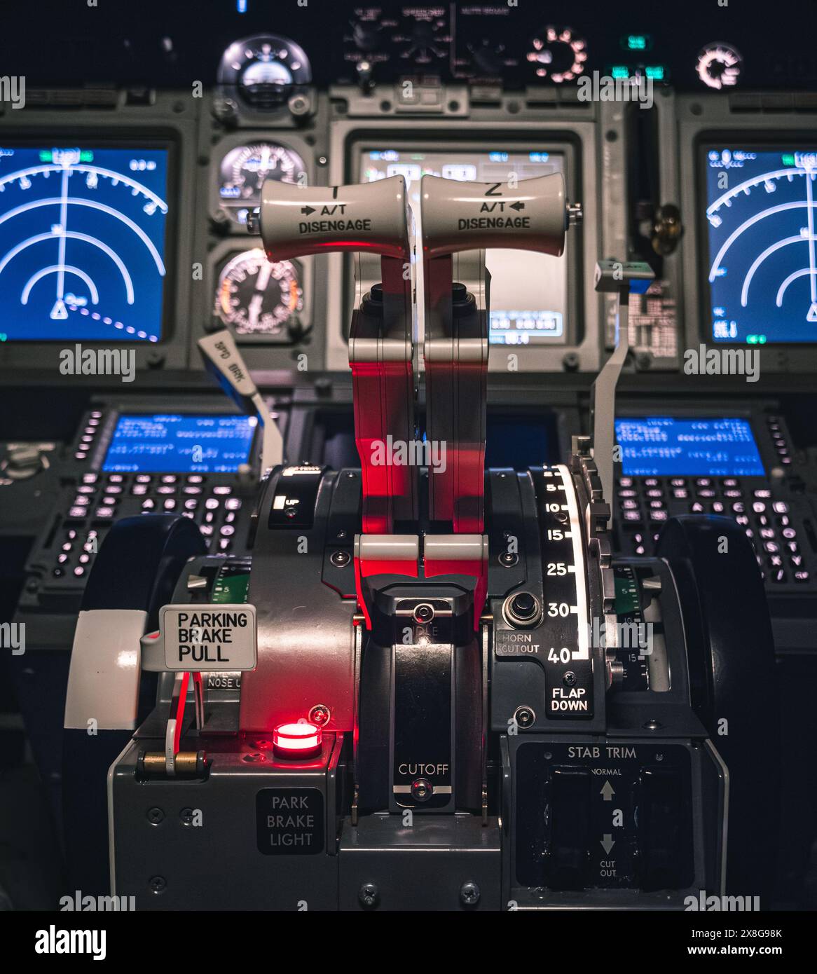 Cockpit view of an airplane during a night-time flight with illuminated ...