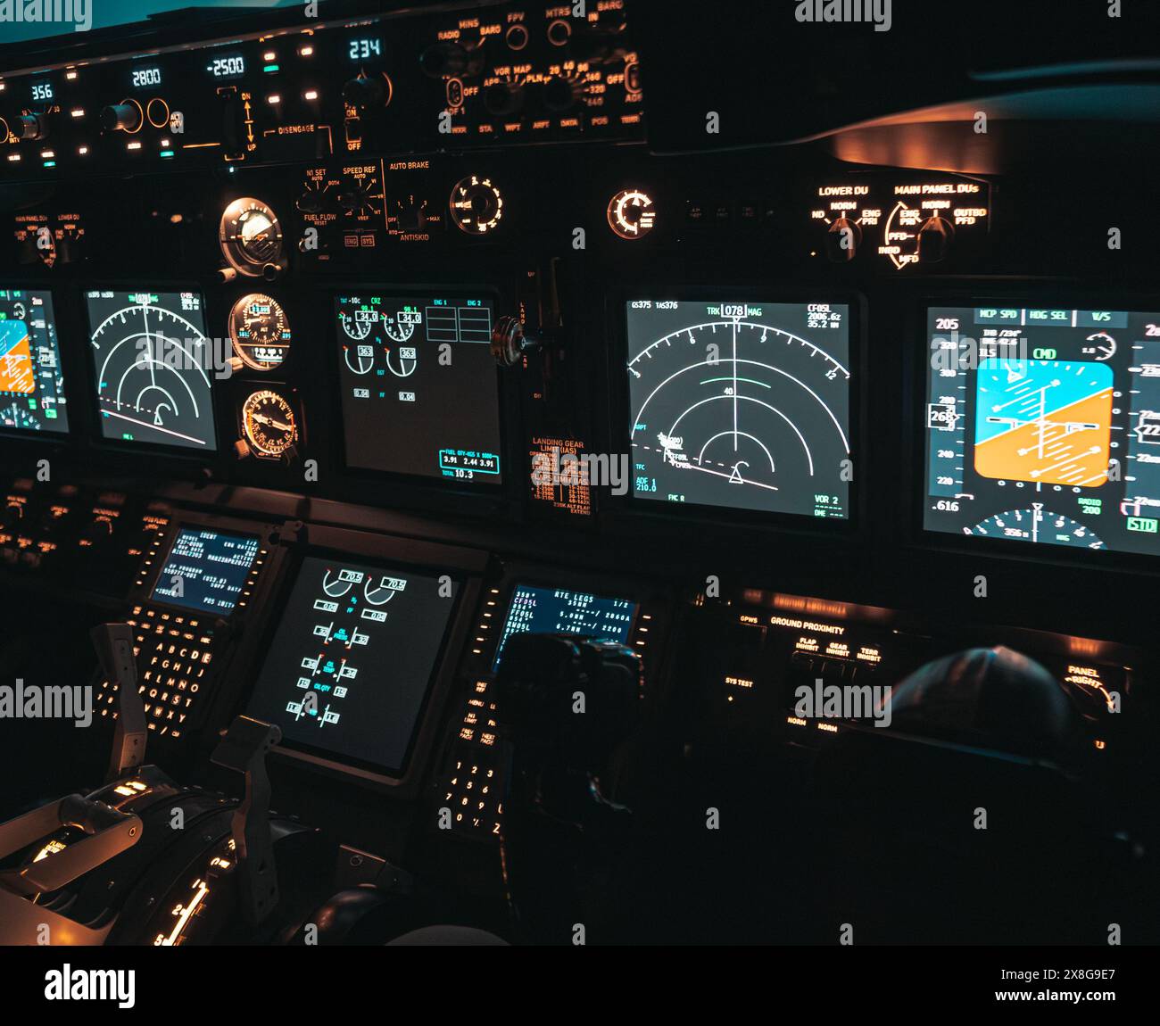 Cockpit view of an airplane during a night-time flight with illuminated ...