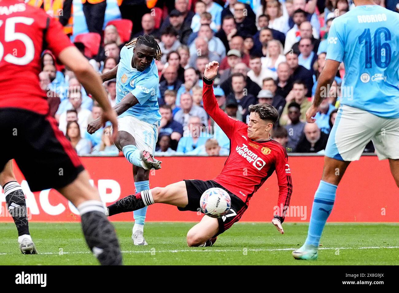 Manchester City's Jeremy Doku scores the third goal of the game during ...