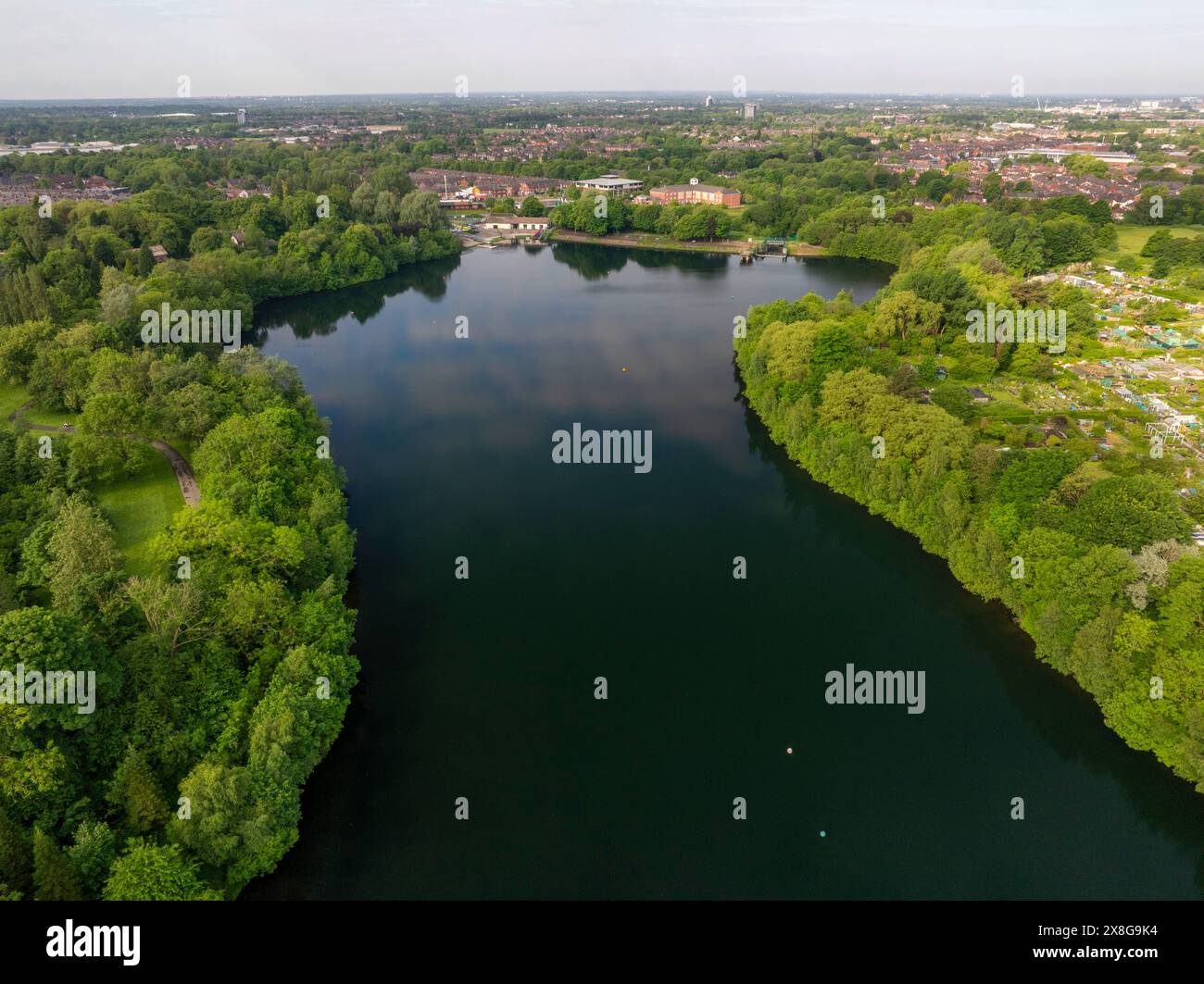 Aerial image of Gorton Reservoirs with Manchester skyline on the ...