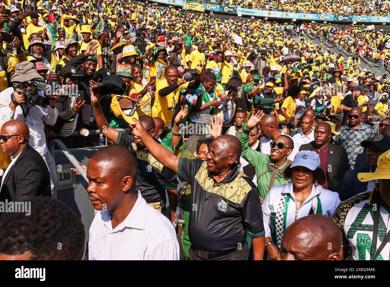 President Cyril Ramaphosa greets the crowd at FNB stadium during the ...