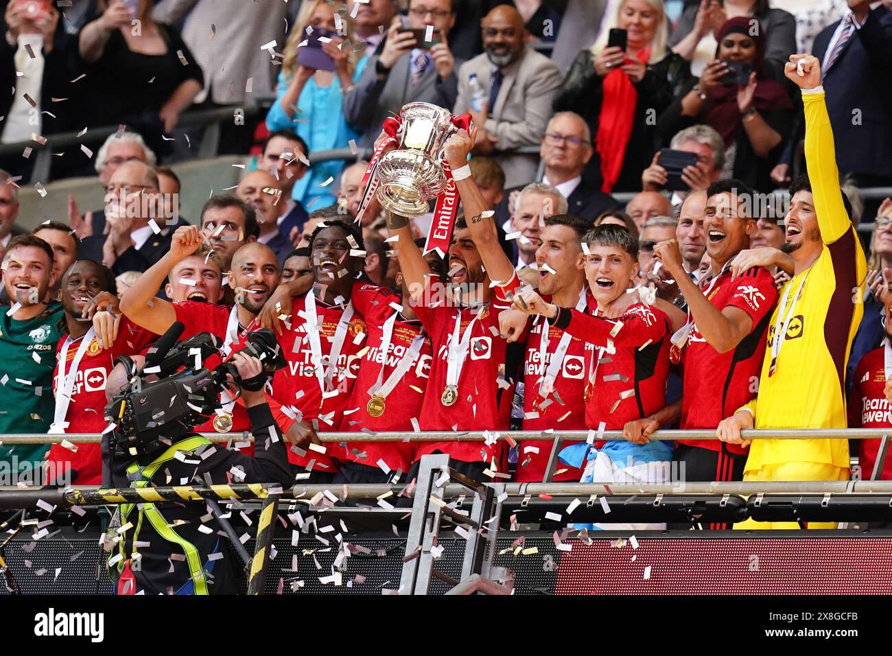 Manchester United's Bruno Fernandes lifts the FA Cup Trophy after ...