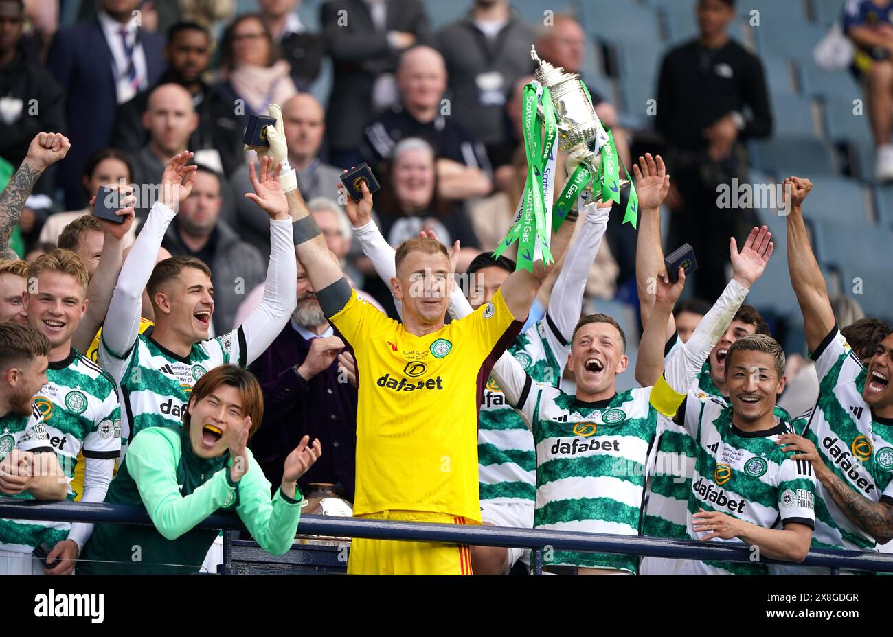 Celtic goalkeeper Joe Hart and Callum McGregor lift the trophy ...
