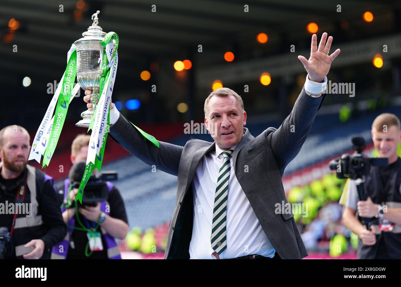Celtic manager Brendan Rodgers celebrates with the trophy after winning ...