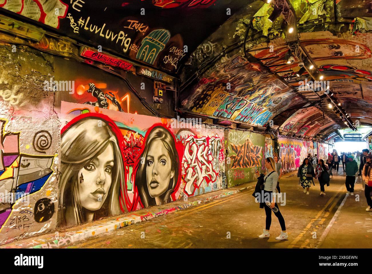 London Leake Street The Graffiti Tunnel visitors view the vivid images ...
