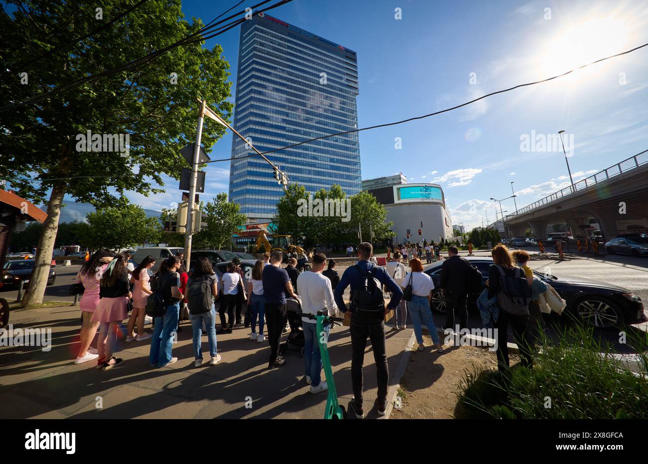 Bucharest, Romania - May 24, 2024: People are crossing the street in ...