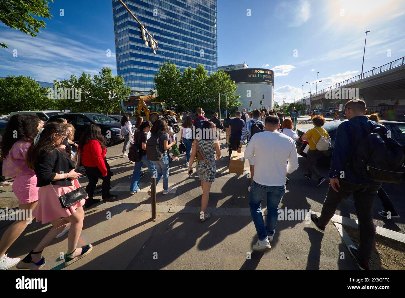 Bucharest, Romania - May 24, 2024: People are crossing the street in ...