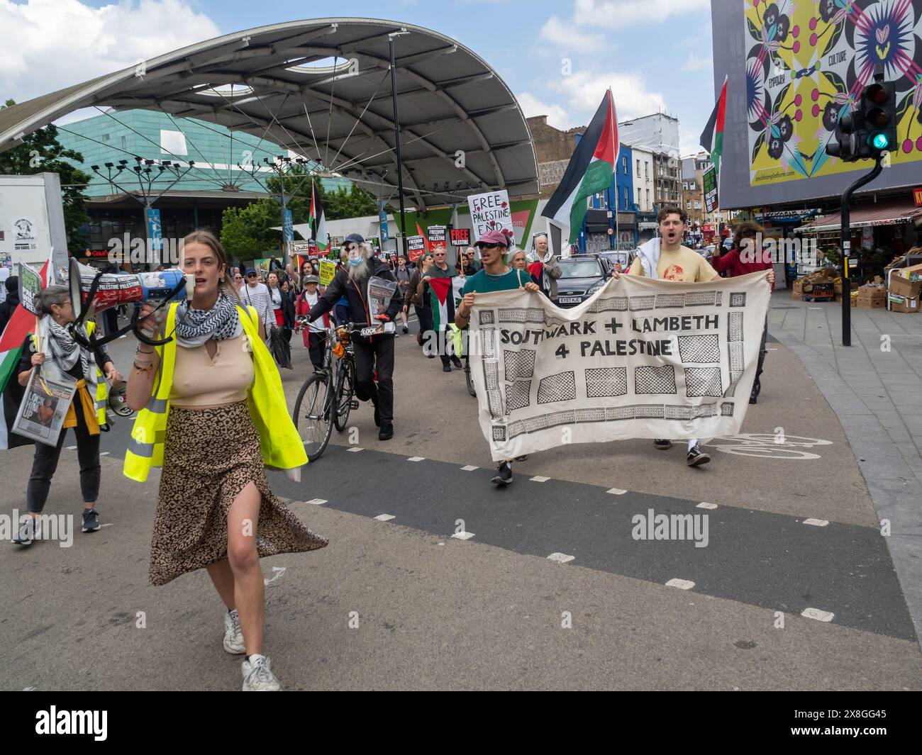 London, UK. 25 May. People in Peckham begin to march to a rally in ...