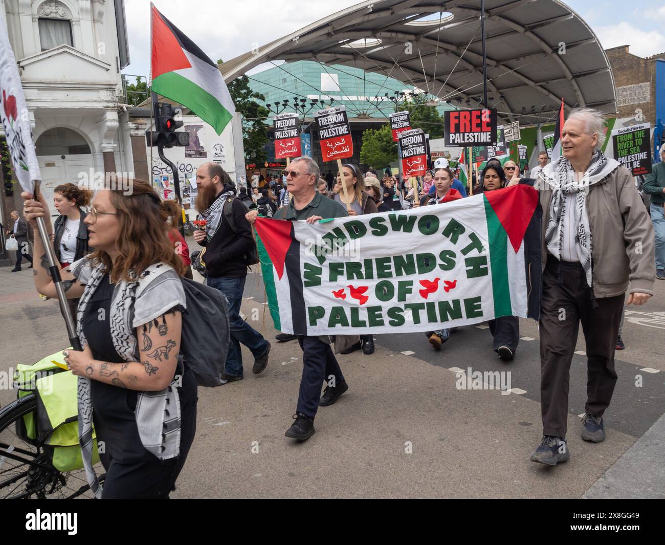 London, UK. 25 May. People in Peckham begin to march to a rally in ...