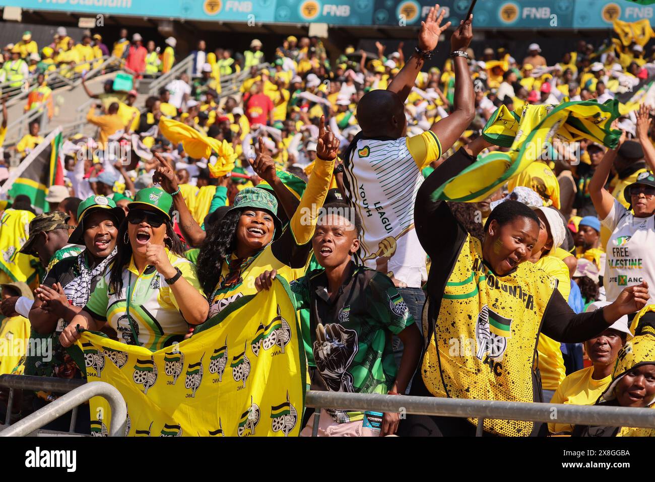 ANC members and supporters chant and wave flags during the final ...